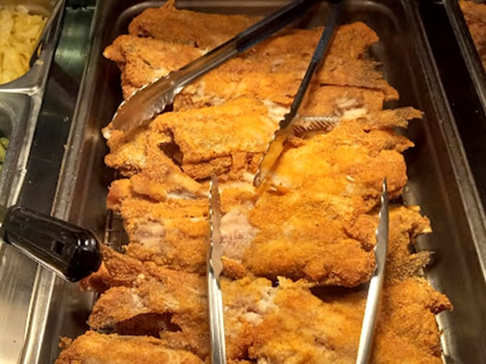 The catfish platter—where those golden-brown fillets have converted more "I don't eat fish" skeptics than any fancy seafood restaurant ever could.