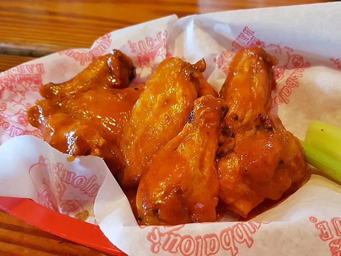 These wings aren't just orange—they're sunset-hued flavor bombs that make you wonder why you ever bothered with those chain restaurant versions.
