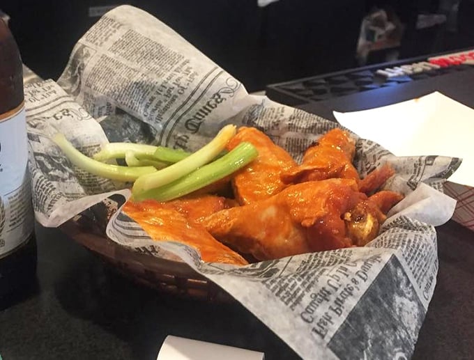 These aren't just wings; they're crispy, saucy little miracles served with the traditional celery sticks—nature's way of pretending you're eating something healthy.
