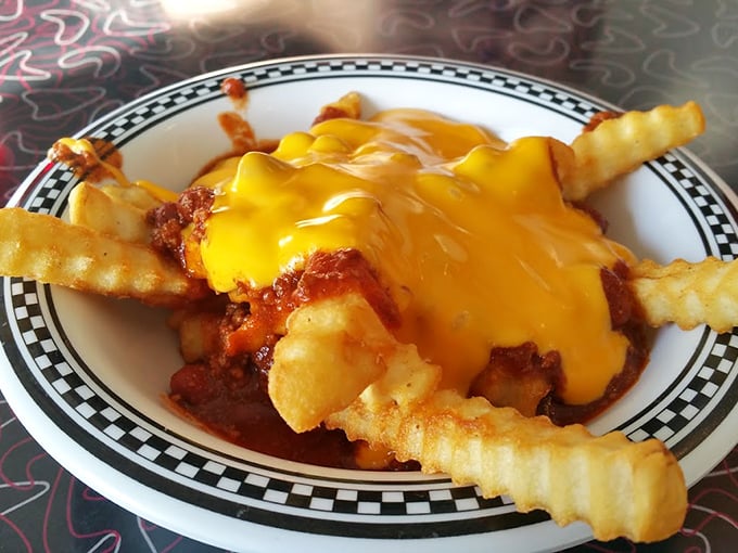 Chili cheese fries: where comfort food meets architectural achievement. Those crispy golden fries somehow maintain their structural integrity beneath that glorious cheese avalanche.