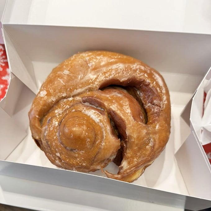 This isn't just a cinnamon roll – it's a spiral-shaped love letter to butter, sugar, and the art of morning indulgence.