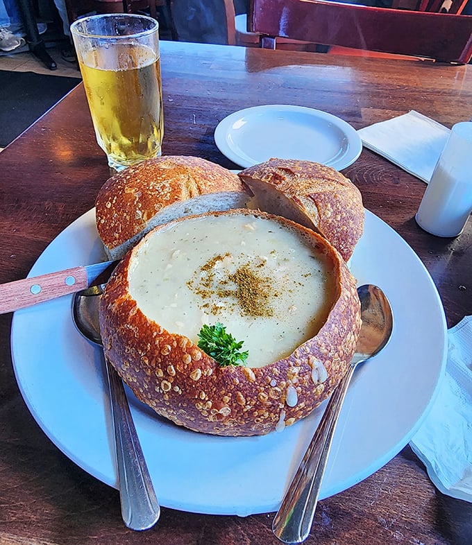 Not just any clam chowder, but the kind that makes you question every other bowl you've ever had. The sourdough bread bowl is non-negotiable.