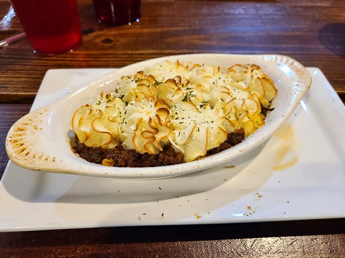 Cottage pie with those perfectly piped potato peaks—like delicious little mountains protecting a savory treasure of meat below.