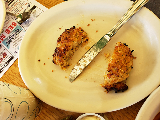 These golden-brown crab cakes aren't just cooked, they're respected. A testament to the simple beauty of seafood done right.