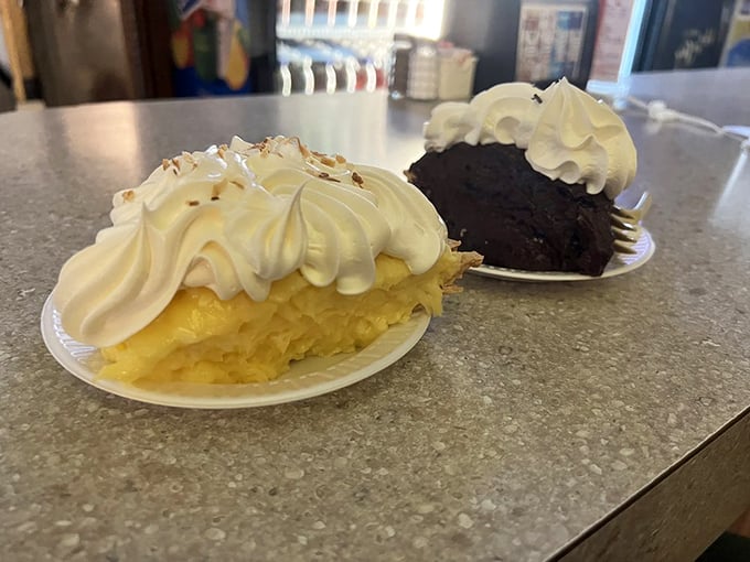 Cream pies that defy gravity with their towering meringue – the coconut and chocolate duo that's worth saving room for, no matter how full you are.