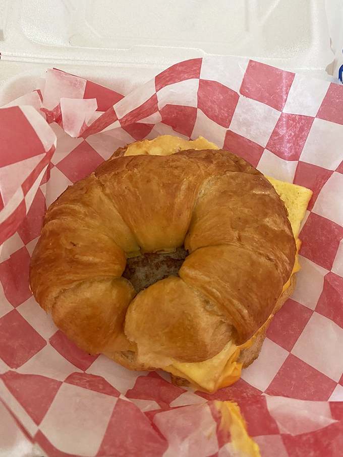 The humble breakfast croissant sandwich – where buttery, flaky pastry meets morning protein in a handheld masterpiece that puts cereal to shame.