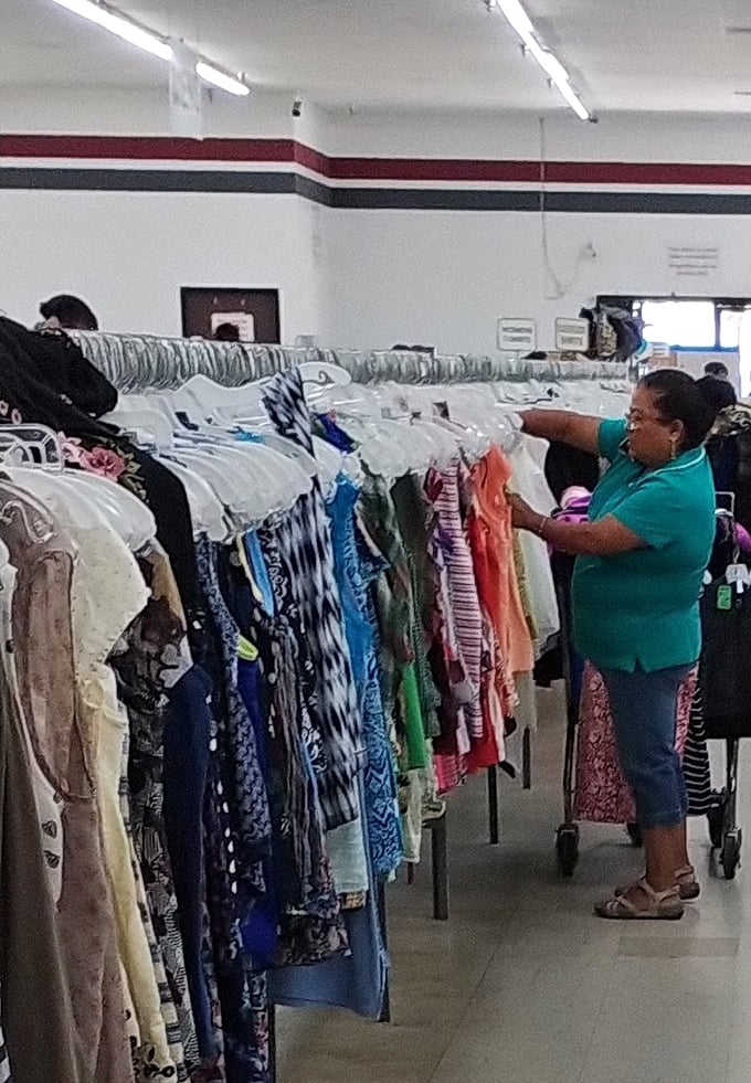 The true experts navigate these aisles with practiced precision. Every flip through the hangers could reveal the next great find.