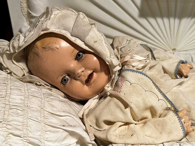 This vintage doll doesn't just look like it's plotting your demise—it's practically writing the screenplay for your nightmares.