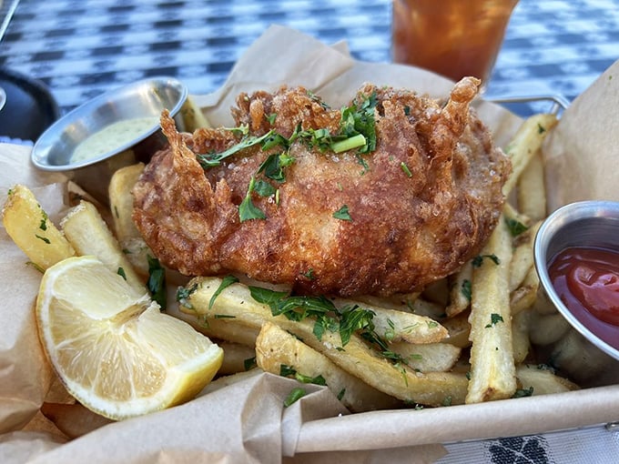 Fish and chips that actually crunch when you bite into them—a rarity that deserves celebration—nestled on a bed of fries that look hand-cut because, miracle of miracles, they actually are.