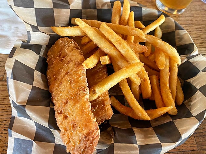 Fish and chips that would make a British pub jealous. Golden, crispy batter protecting flaky white fish—a perfect marriage of crunch and tenderness.