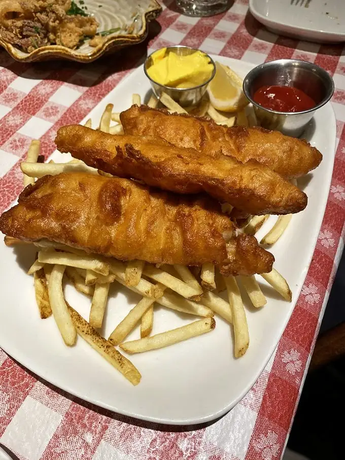The fish and chips that launched a thousand cravings. Crispy, golden batter protecting flaky white fish – a simple pleasure elevated to art form.