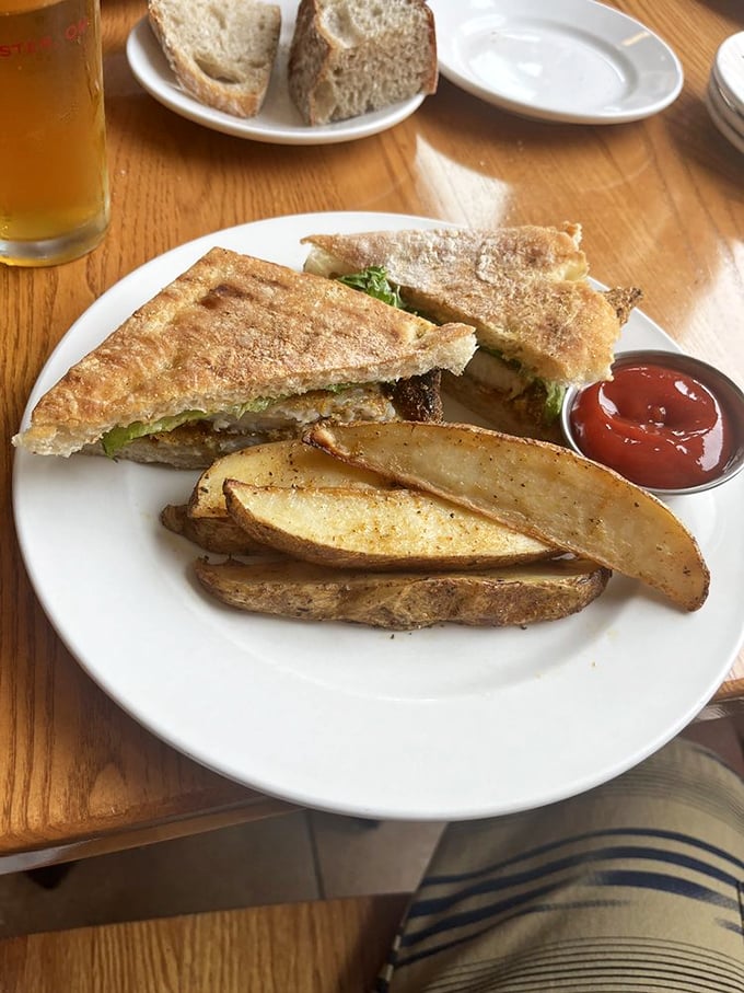 The legendary fish sandwich arrives with potato wedges that make French fries nervously question their life choices.