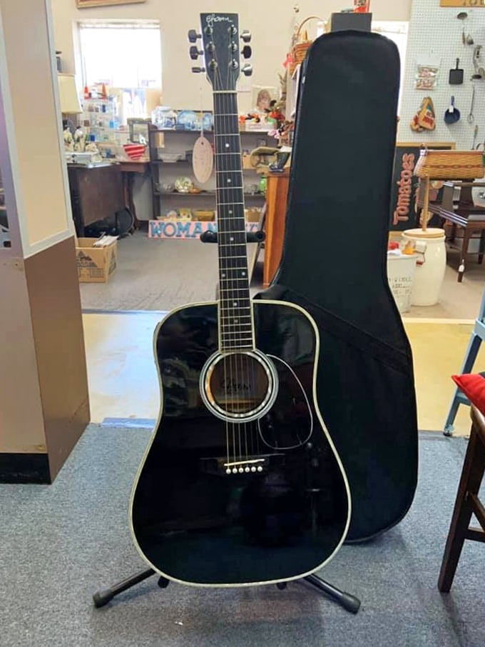 This black beauty isn't just a guitar—it's someone's abandoned rock star dreams waiting for a second act in your living room.