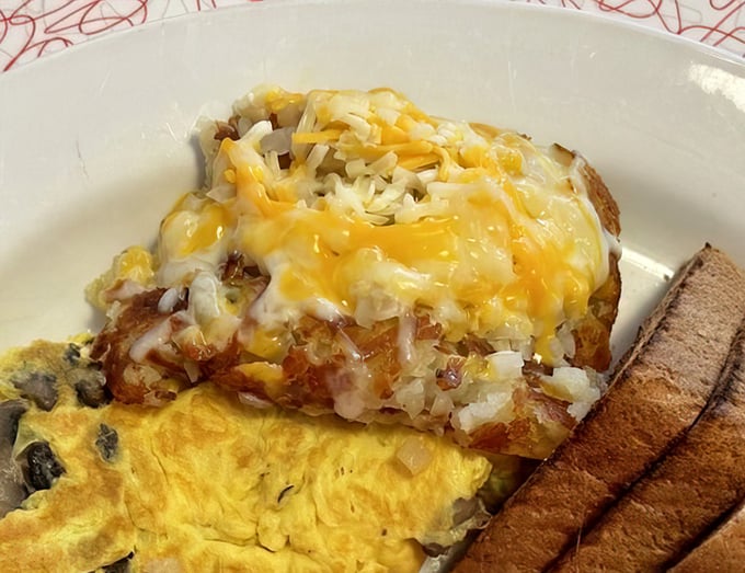 These aren't just hash browns—they're a golden-crisp foundation topped with melted cheese that makes you question why potatoes ever appear in any other form.