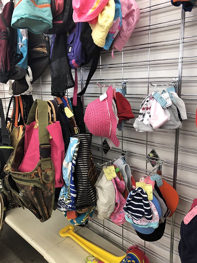 A colorful array of hats, bags, and children's accessories awaits new owners. One shopper's outgrown treasures become another family's perfect finds.