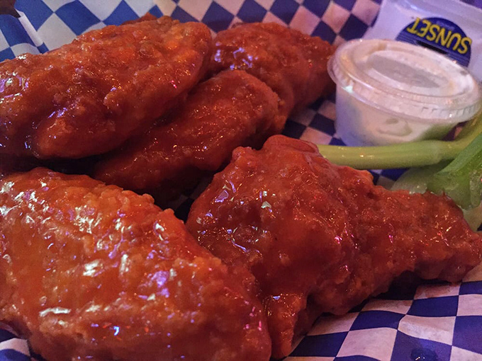 Wings so saucy they should come with their own napkin dispenser. That blue-checkered paper is about to meet its match.