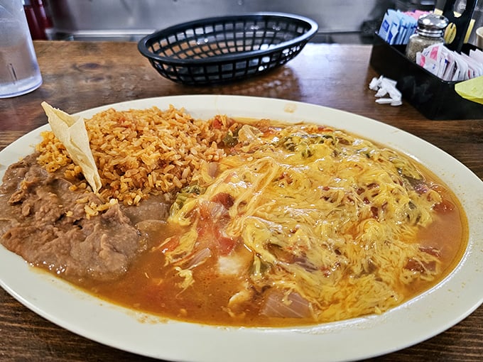 When your breakfast requires its own area code—huevos rancheros at El Tepeyac come swimming in a sea of cheese and flavor.