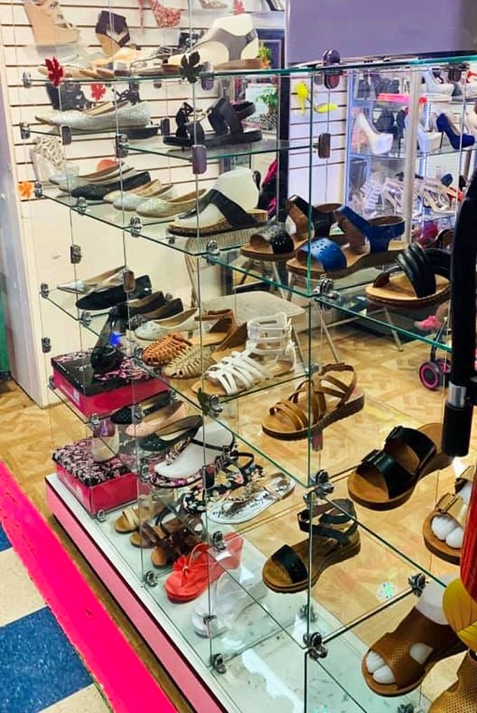 Glass shelves showcasing footwear fantasies for every occasion. Like Cinderella's closet, if Cinderella had practical taste and a modest budget.
