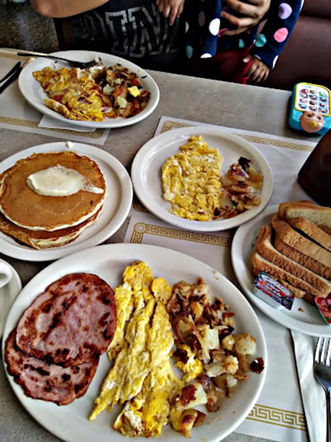 The breakfast spread that launched a thousand food comas. Those pancakes aren't just a meal—they're an edible security blanket.