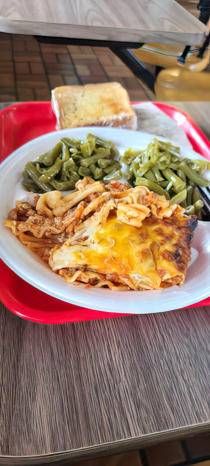 Comfort on a plate: Melted cheese blankets hearty lasagna alongside crisp green beans. Grandma would approve—and maybe be a little jealous.