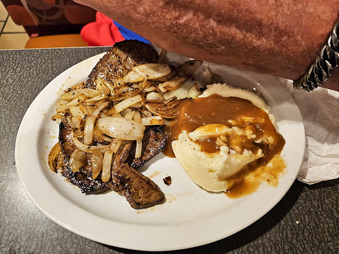 This isn't just liver and onions – it's comfort on a plate, with gravy-smothered mashed potatoes that could solve most of life's problems.
