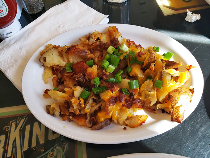 These loaded homefries aren't just a side dish – they're a masterpiece of crispy potatoes, melted cheese, and green onions that puts regular fries in therapy.