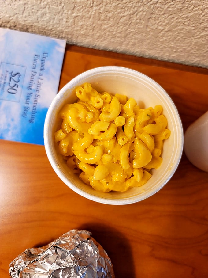 Mac and cheese that glows like Texas sunshine—comfort food that doesn't apologize for being exactly what you need right now.