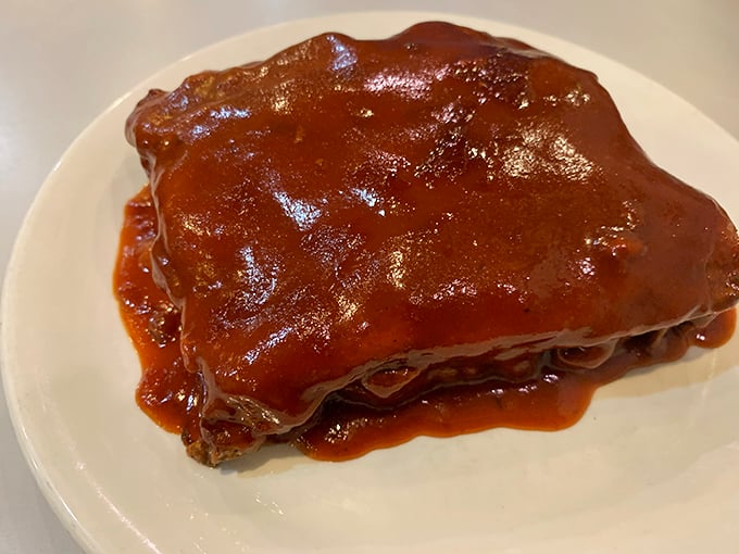This isn't just meatloaf – it's a saucy slab of nostalgia that would make your grandmother simultaneously proud and jealous of their recipe.