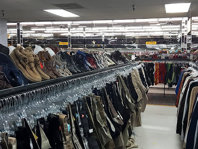 The men's section: where forgotten suits that closed business deals now hang patiently, waiting for their next boardroom adventure.