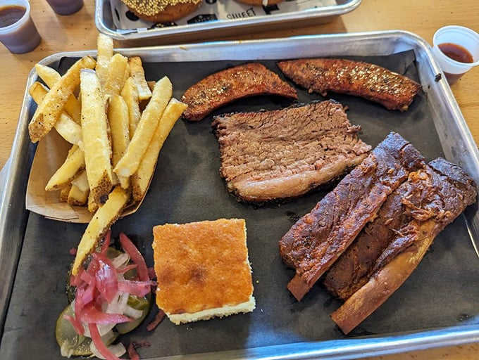 A barbecue tray that would make a Texan tip their hat—thick-cut brisket alongside perfectly seasoned fries and classic accompaniments.