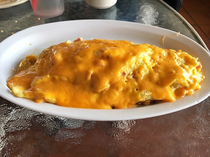 This cheese-blanketed omelet isn't just breakfast – it's a commitment. The kind of morning meal that might require an afternoon nap.