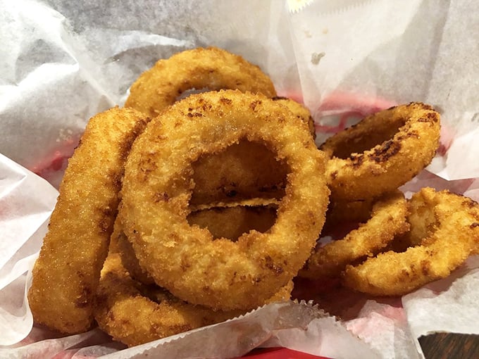 Golden-brown onion rings with that perfect crunch-to-sweetness ratio—the supporting actor that sometimes steals the scene from the main course.