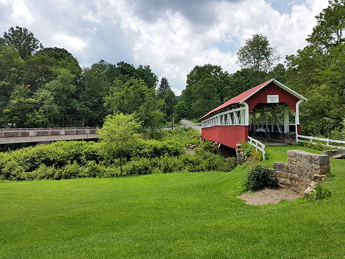 A perfect summer day showcases the bridge's picturesque setting. That manicured lawn wasn't an accident—someone loves this historic treasure.