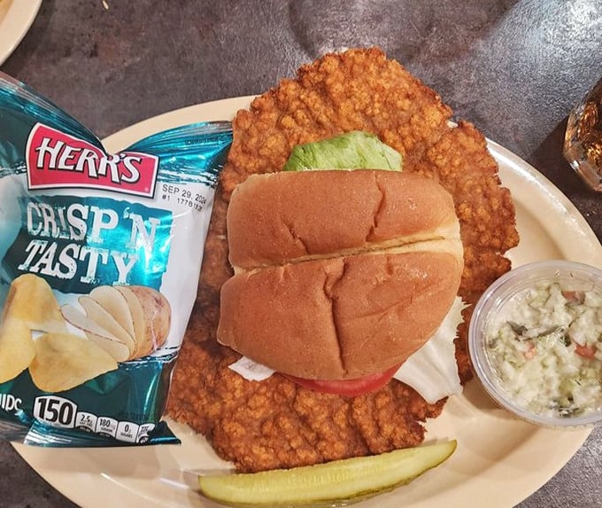 That pork tenderloin is bigger than your head and twice as satisfying – Midwest comfort on a bun.