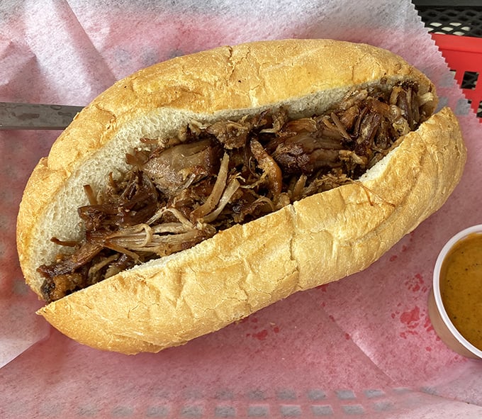 Pulled pork perfection – tender, juicy meat cradled in a fresh roll. The kind of sandwich that demands both napkins and your undivided attention.