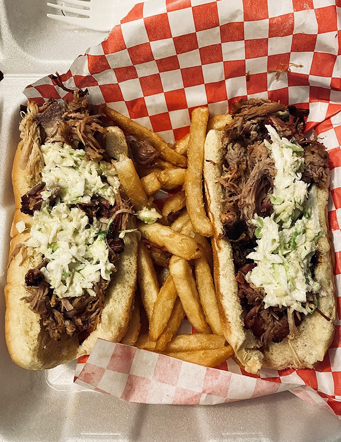 Two pulled pork sandwiches with the perfect slaw-to-meat ratio—like a barbecue mathematician solved a delicious equation.