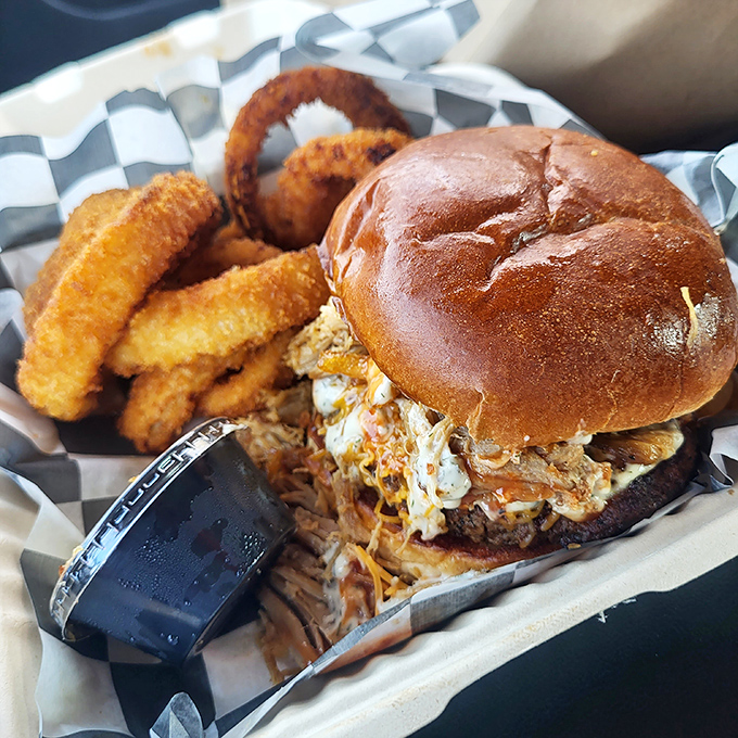 This isn't just a sandwich – it's an engineering marvel of pulled pork, slaw, and a bun that somehow contains the delicious chaos.