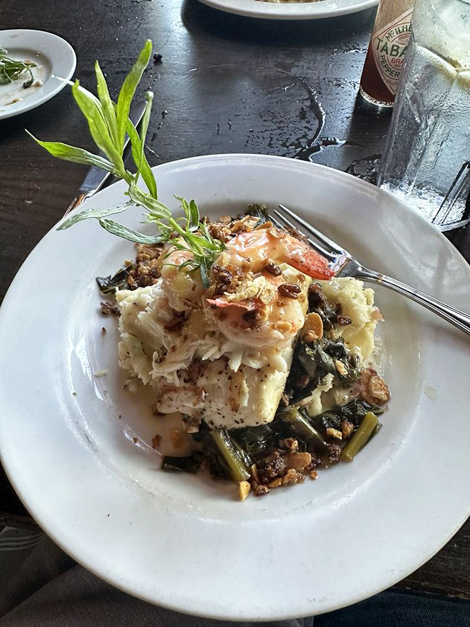 Fish this fresh deserves its own spotlight. Perched atop collard greens with a crown of shrimp—Southern royalty on a plate.