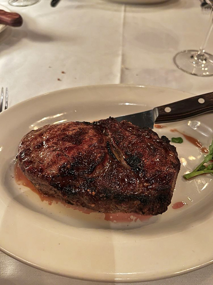 A perfectly seared ribeye that deserves its own ZIP code. The crust-to-tender-center ratio here is what meat dreams are made of.
