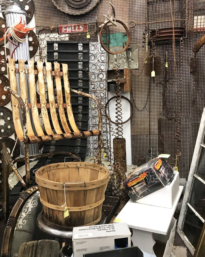 Where old farm equipment goes to find new purpose. That wooden bushel basket has probably seen more harvests than most farmers today.