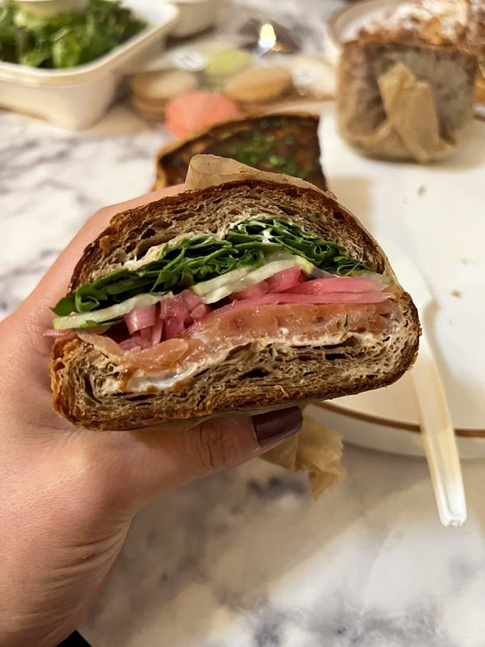 Behold the salmon sandwich that launched a thousand lunch breaks – this is why you came, folks.