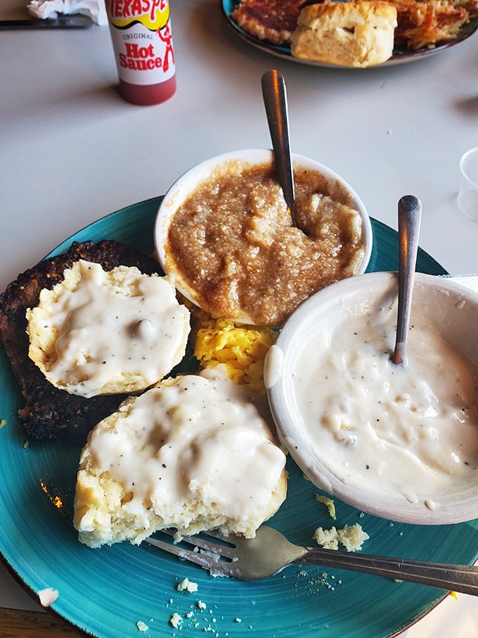 Biscuits swimming in creamy sausage gravy – the kind of breakfast that makes you want to write poetry about carbohydrates.