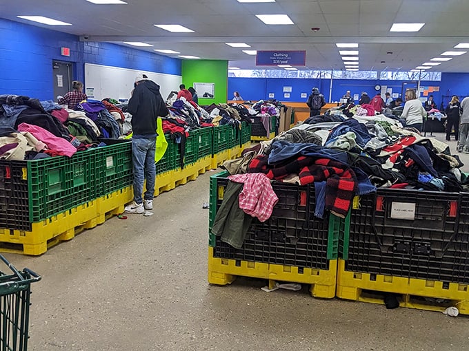 The thrill of the hunt in action—shoppers navigate the clothing bins like seasoned explorers, each with their own treasure map.