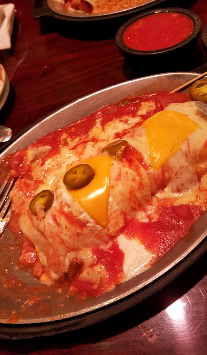 Cheese stretches toward the heavens in this saucy masterpiece—proof that sometimes the messiest foods are life's greatest pleasures.