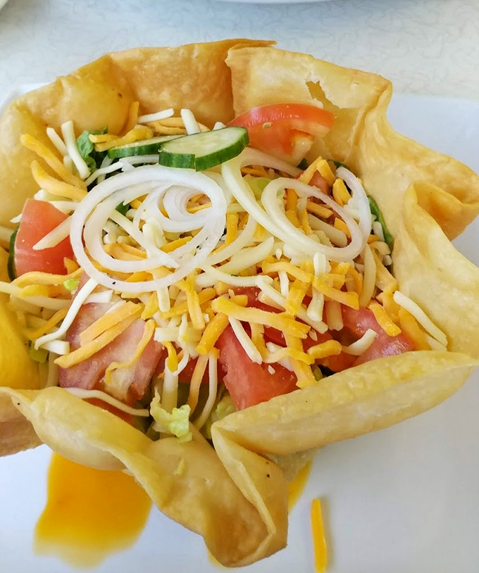 Taco salad served in a crispy shell bowl – because sometimes your food should come in an edible container. Genius!