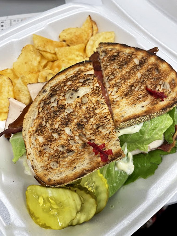 This turkey club stands taller than a linebacker and tastes better than victory on Sunday.