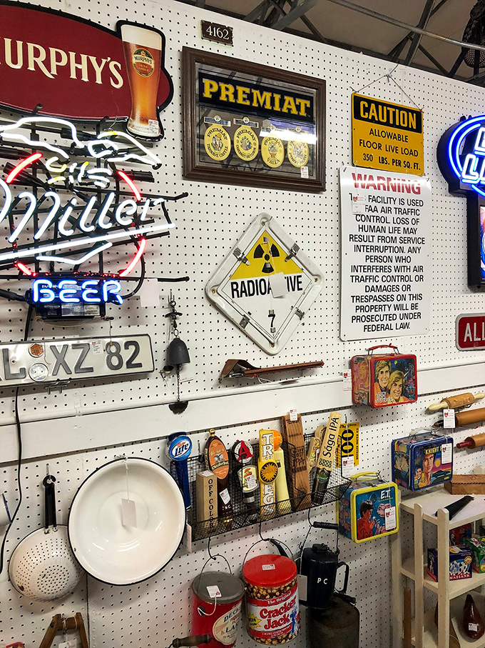 The neon beer signs and vintage advertisements create a time capsule that would make Don Draper reach for his checkbook.