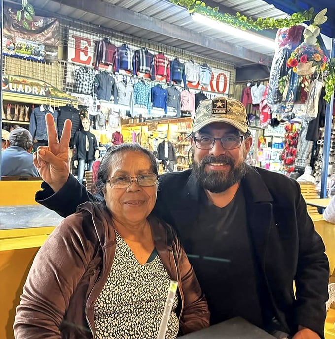 The image shows shoppers browsing merchandise at the swap meet, where every aisle offers new discoveries and potential treasures.