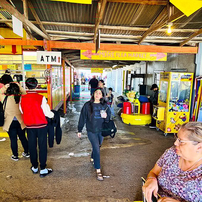 The "MORE FLEA MARKET" sign isn't just a direction—it's an invitation to adventure that shoppers follow with the enthusiasm of kids chasing an ice cream truck.