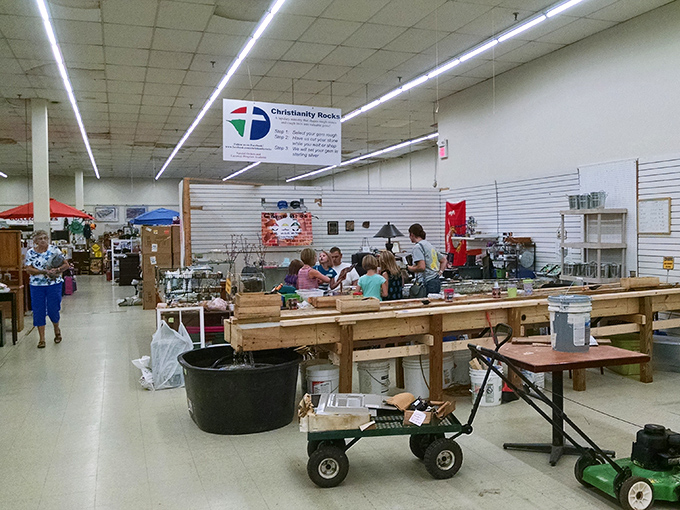 Under the "Christianity Rocks" banner, shoppers gather around tables of potential treasures—the community aspect of flea marketing at its finest.